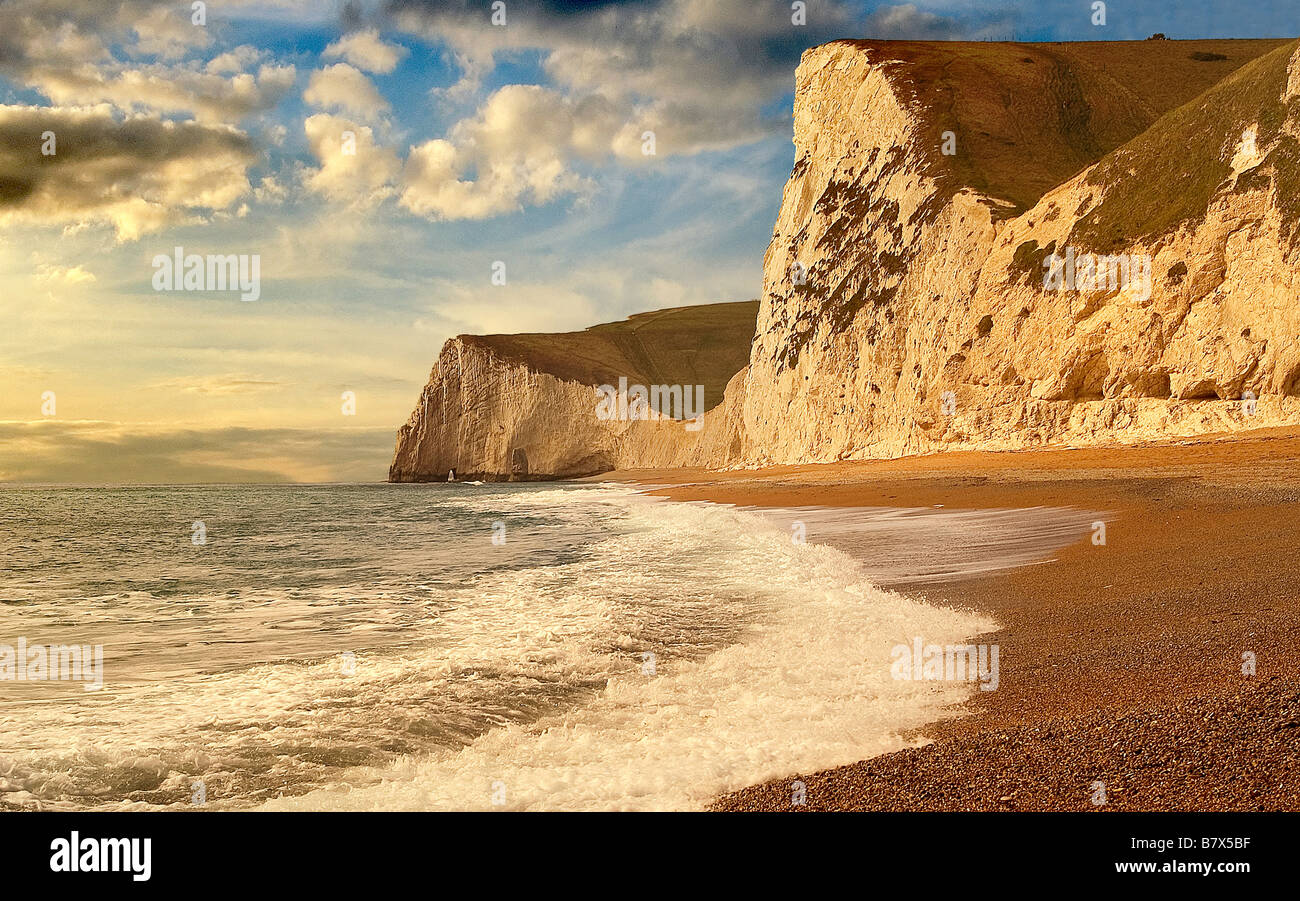white cliffs, shingle and sea near Lulworth Cove Dorset in the Summer ...
