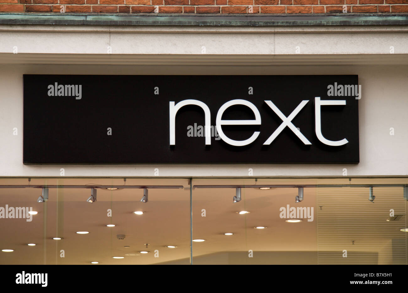 A shop sign above the Next clothing shop on Oxford Street, London. Jan ...