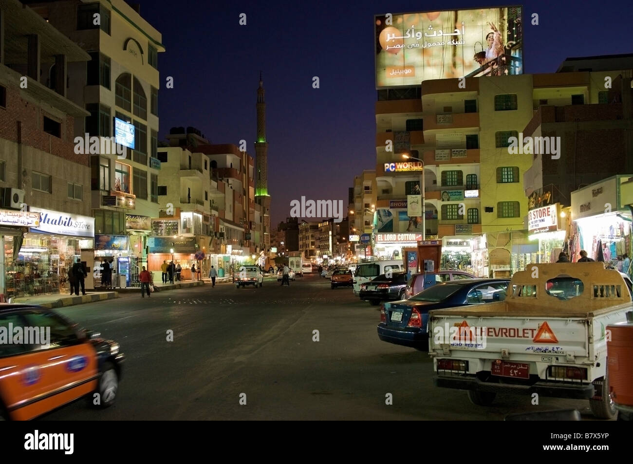 nightscene of busy street with cars and shops in egypt Stock Photo - Alamy