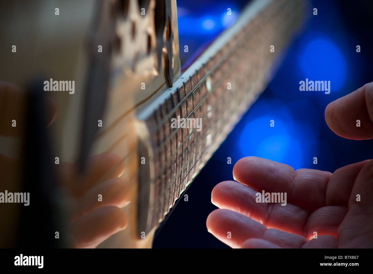 A close up of a guitar being played Stock Photo - Alamy