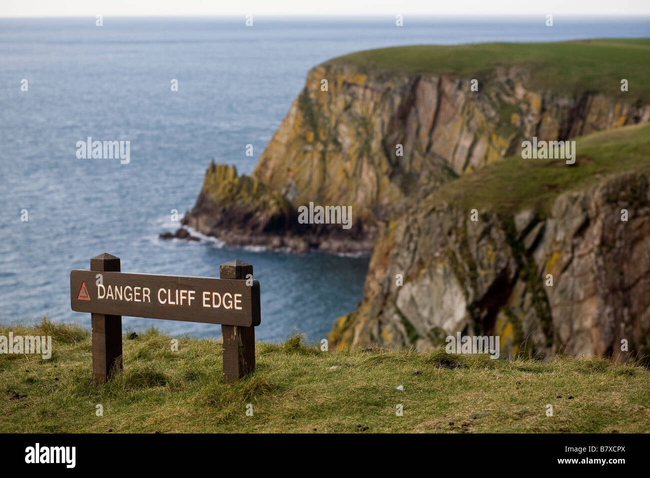 Sign warning of dangerous cliffs at the Mull of Galloway Stock Photo ...