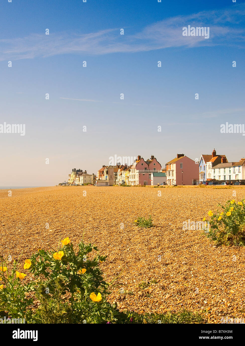 Aldeburgh beach, Suffolk, England - a shingle beach with blue sky and ...