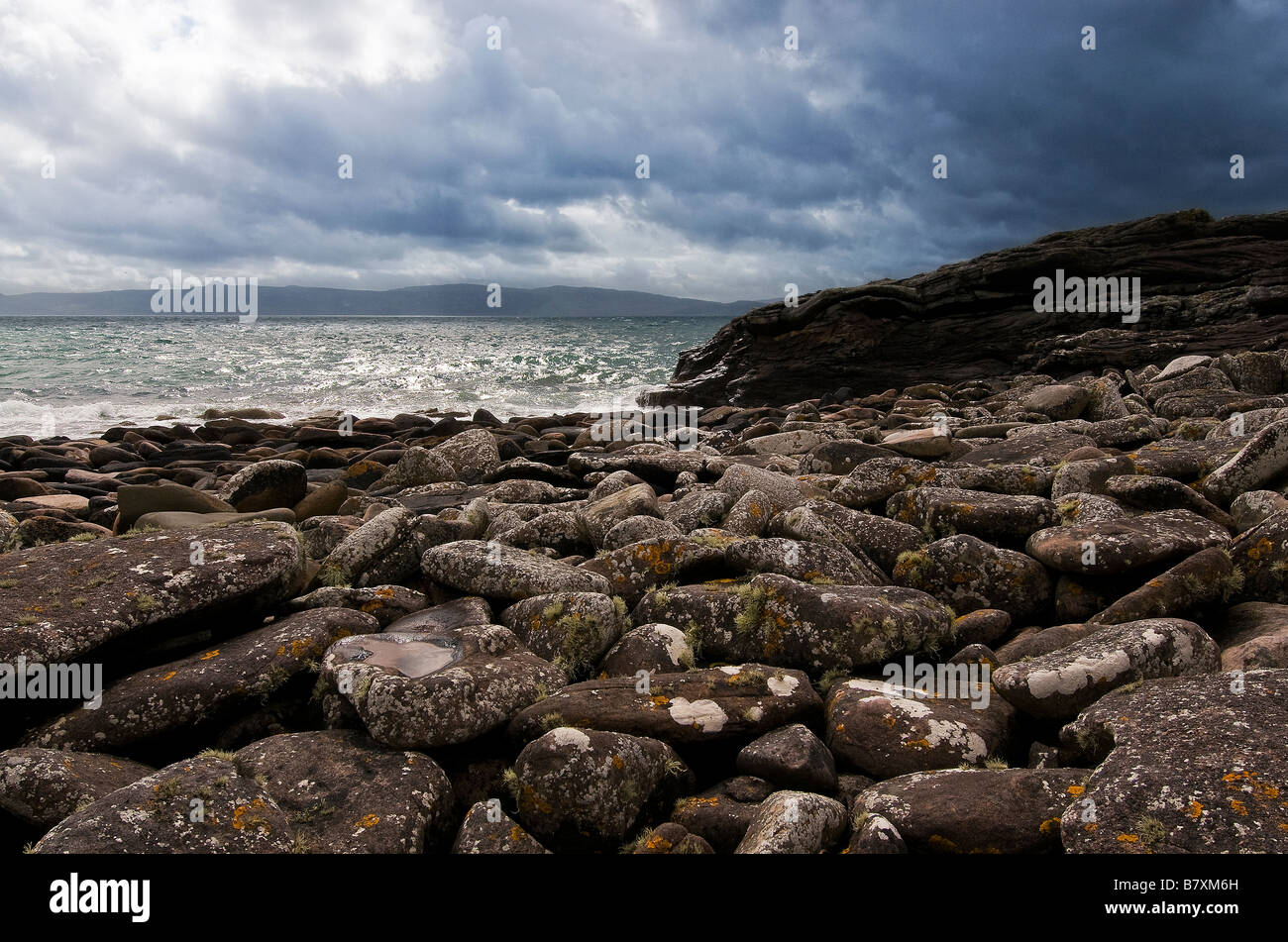 Rocky bay looking towards Raasay from Applecross, north west Scotland ...