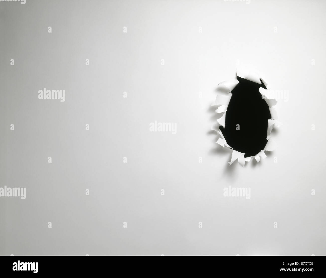 Burst through paper hi-res stock photography and images - Alamy