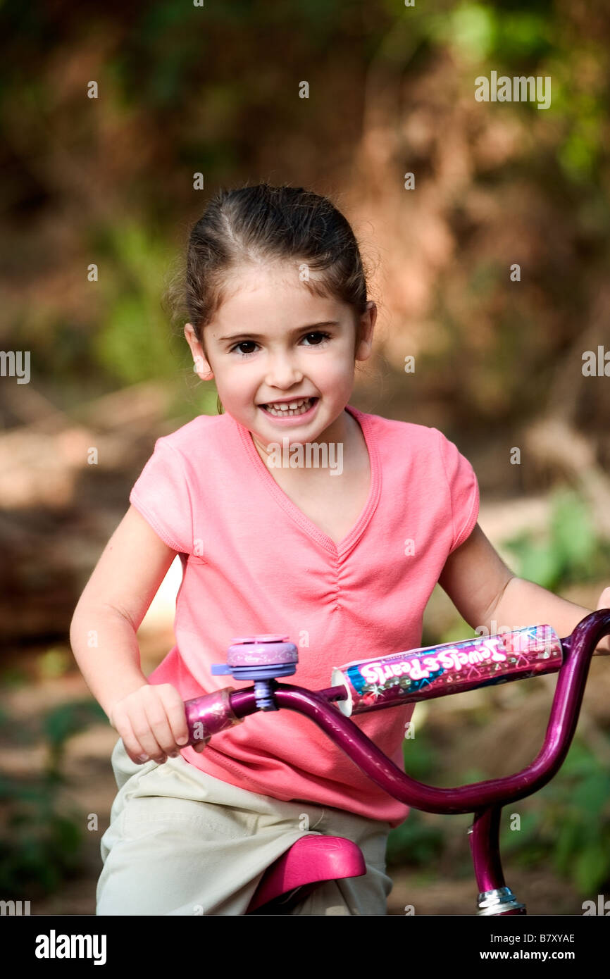 little girl on bicycle park trail Stock Photo - Alamy