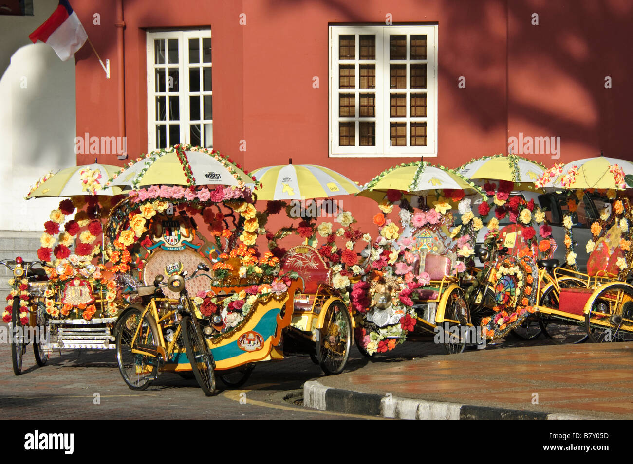 Colourful rickshaws lined up in the street in Melaka, Malaysia Stock ...