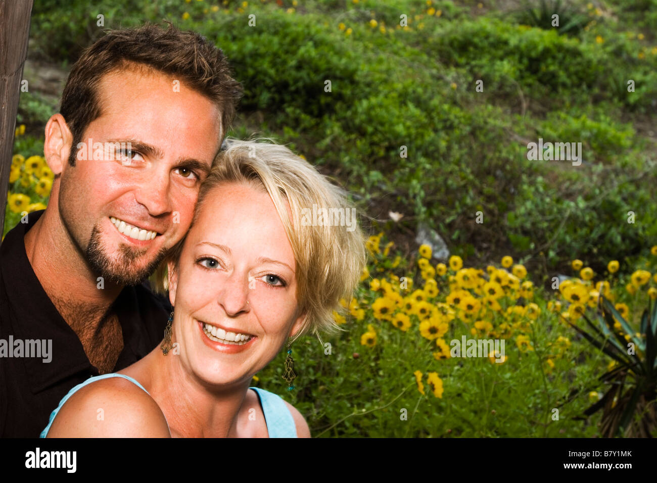 couple holding each other smiling, portrait Stock Photo - Alamy