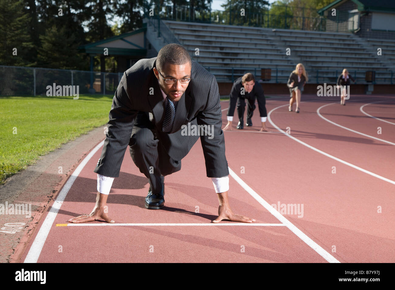 Business people on race track Stock Photo - Alamy