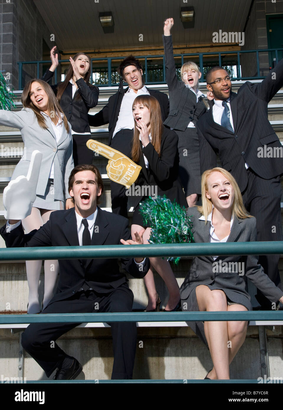 Business people cheering in the stands Stock Photo - Alamy