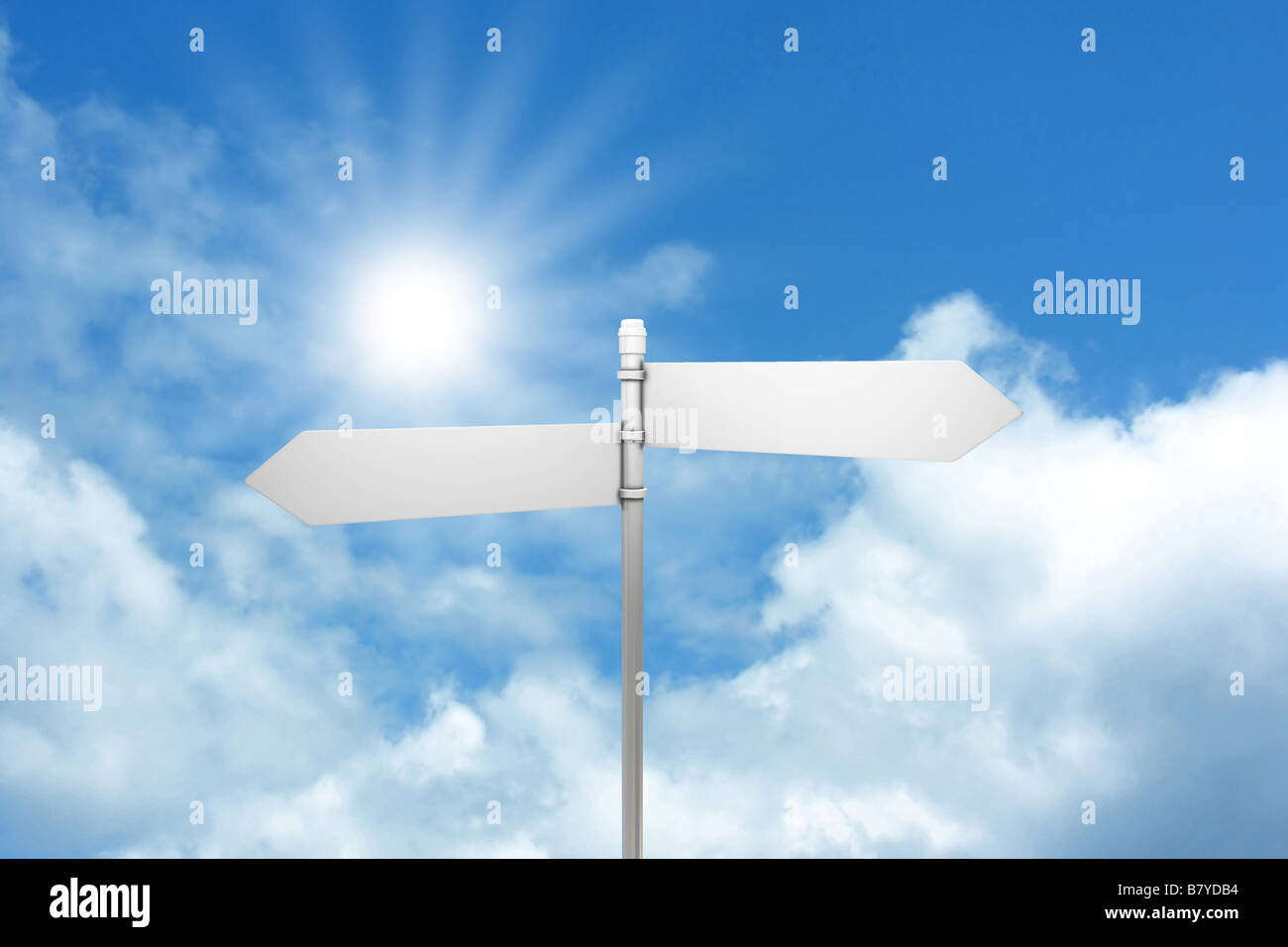 Signpost against blue sky with white clouds Stock Photo - Alamy