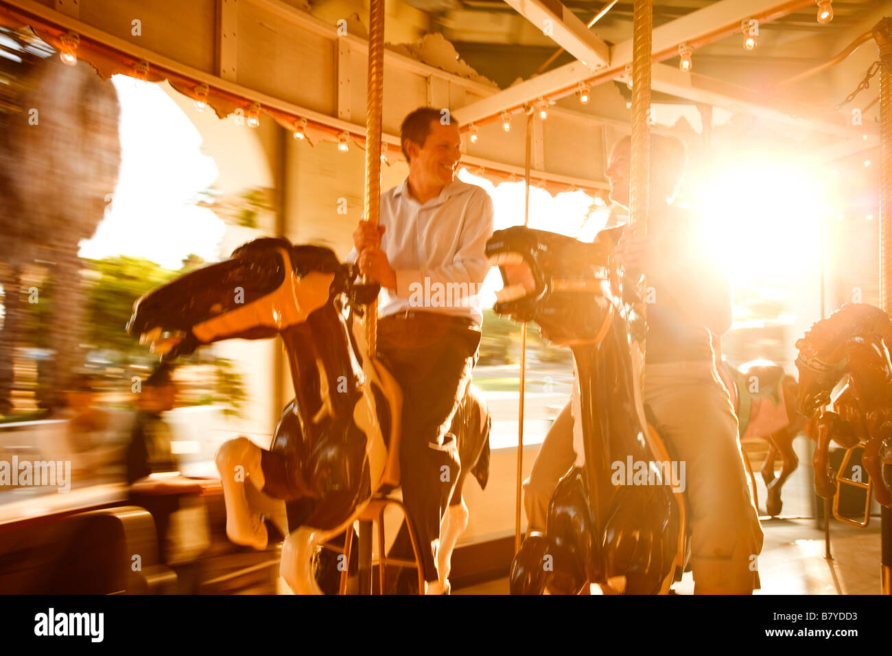 Woman riding carousel horse hi-res stock photography and images - Alamy