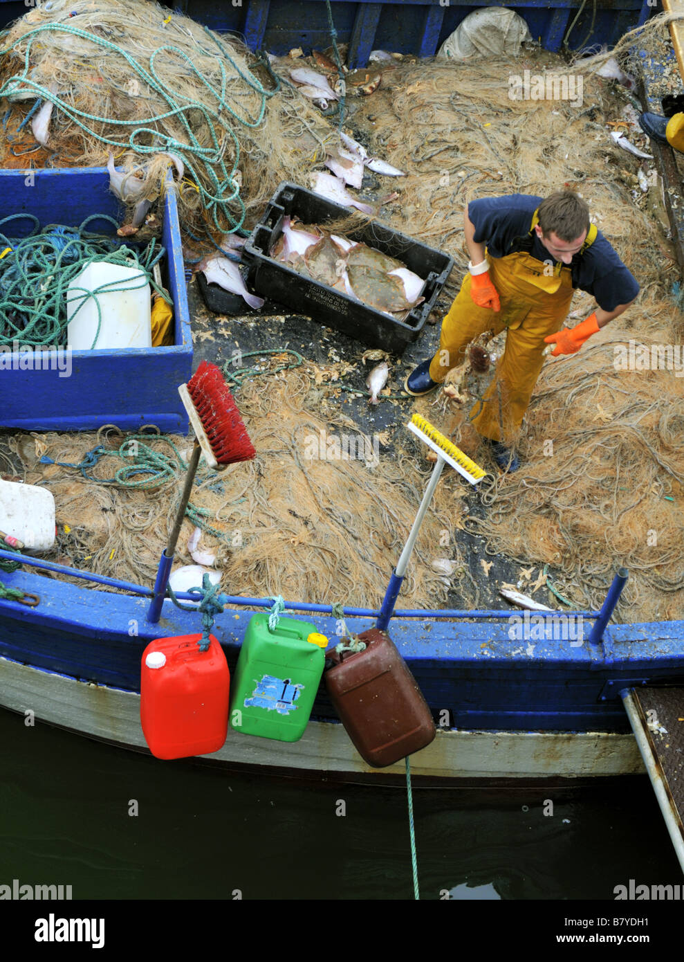 French fisherman and fishing boat at the port of Boulogne-sur-Mer ...