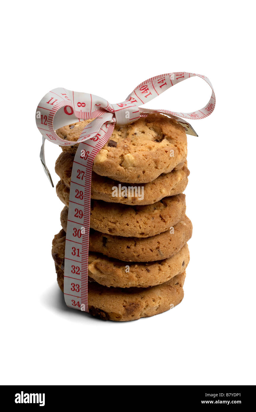 Pile of cookies gift wrapped with tape measure Stock Photo - Alamy