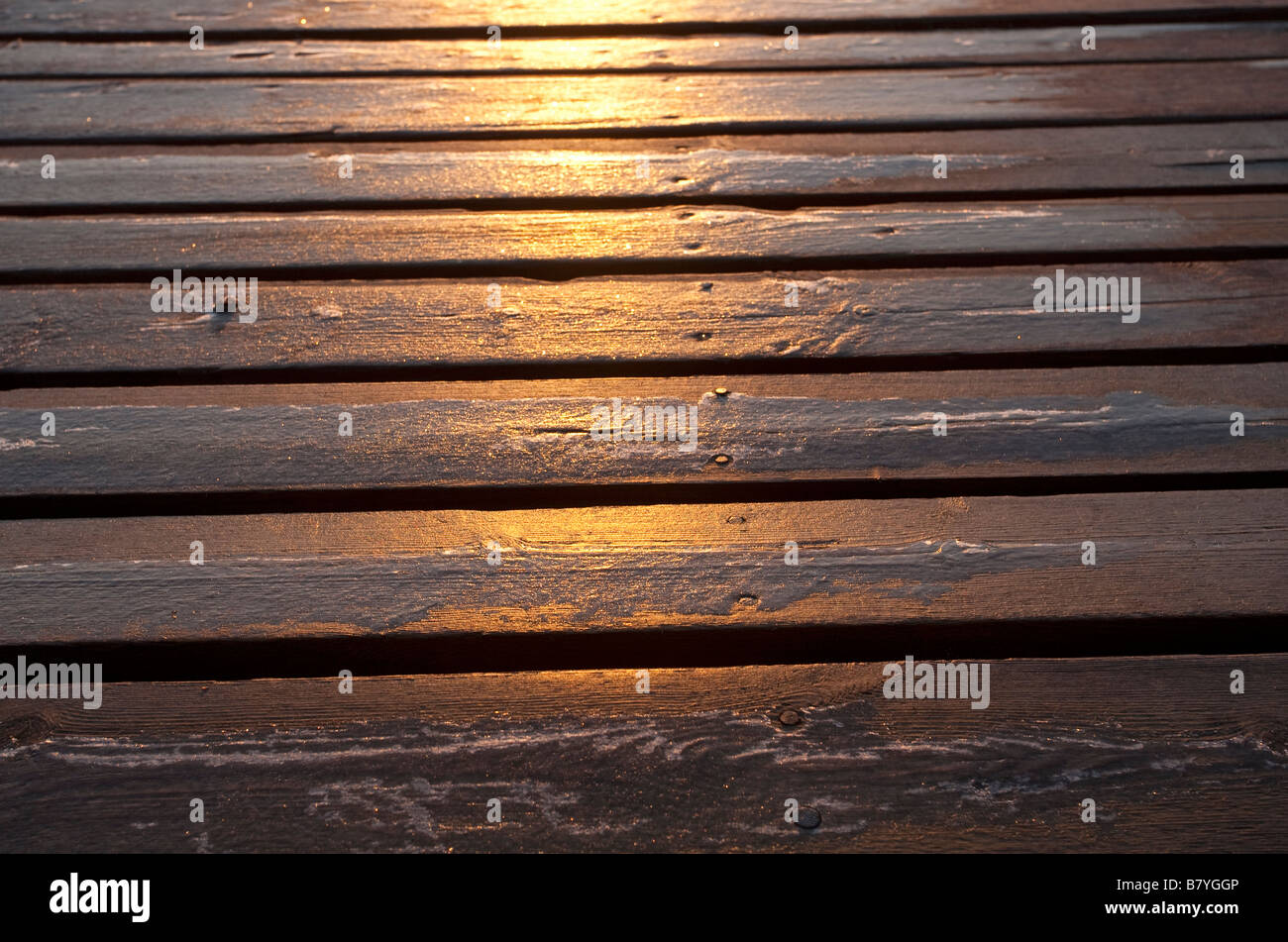 Ice covered wooden boards Stock Photo - Alamy