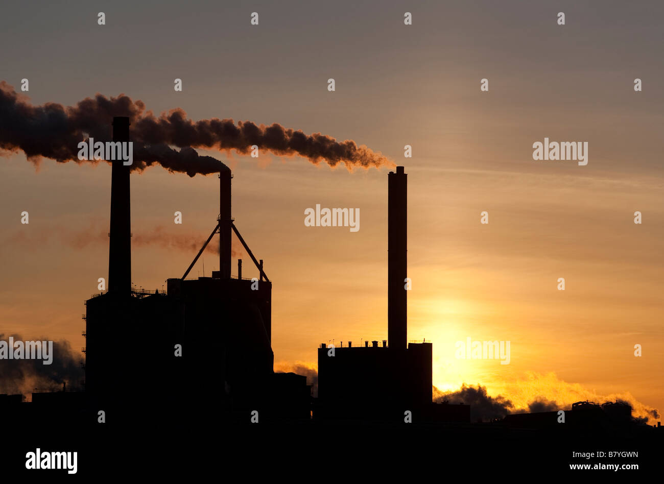 Silhouette of Stora-Enso paper mill buildings at dawn , Nuottasaari ...