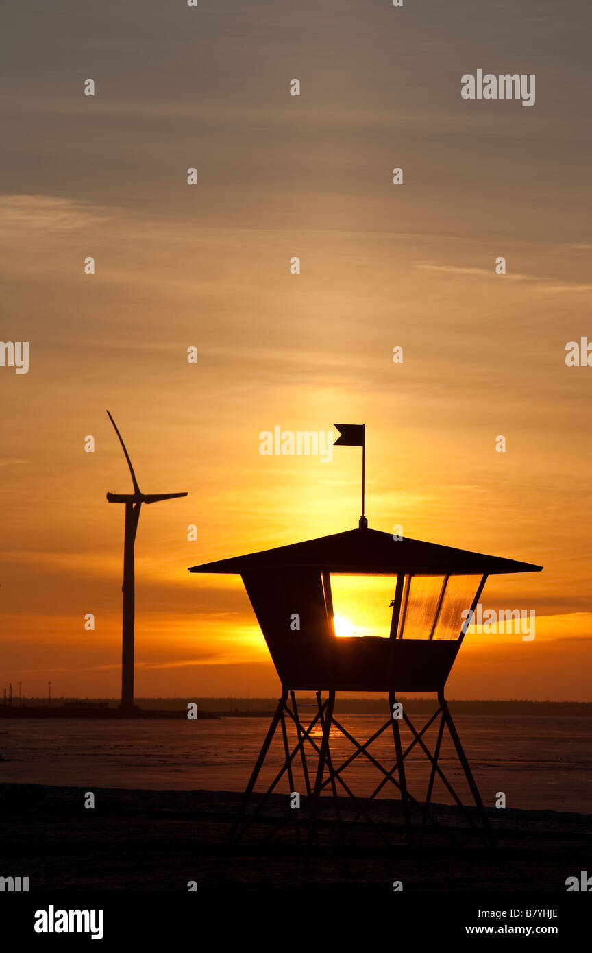 Windmill and lifeguard's watchtower at seashore , Finland Stock Photo ...