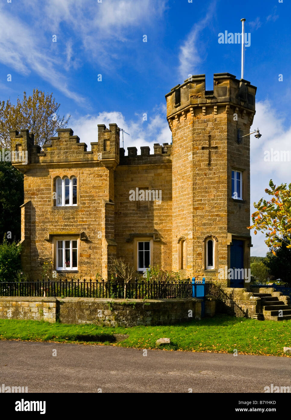 Castellated gate house in Edensor model village near Bakewell in the ...