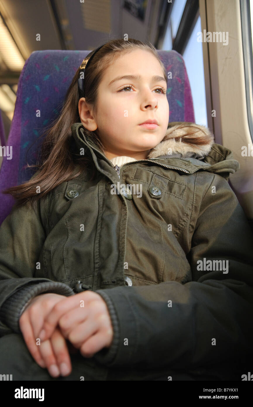 young girl sitting on a train Stock Photo - Alamy
