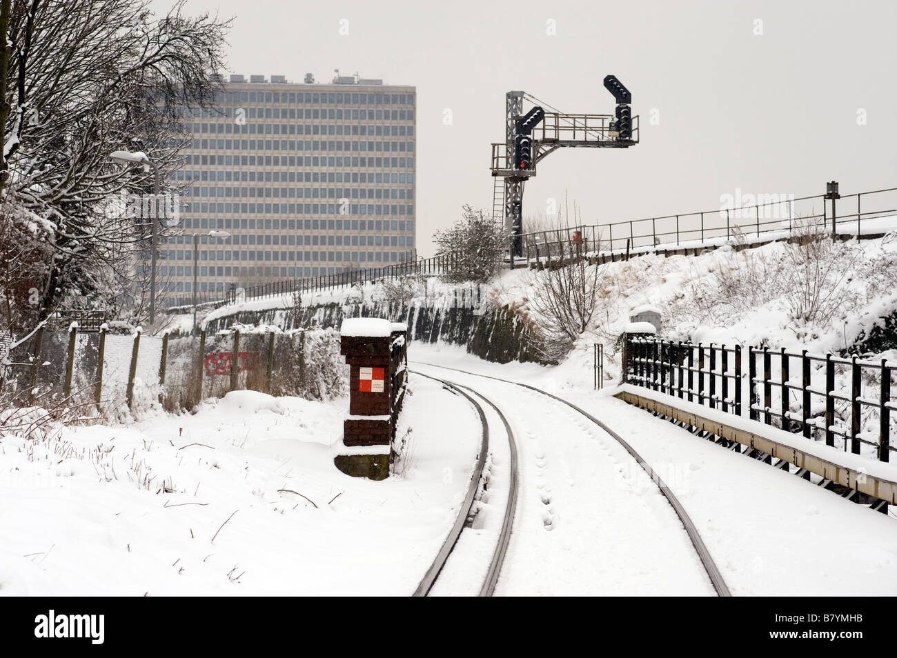 A snown covered railway line and train signal Stock Photo - Alamy