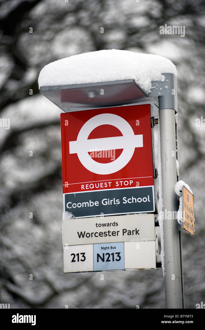 A snow covered London Bus stop sign Stock Photo - Alamy