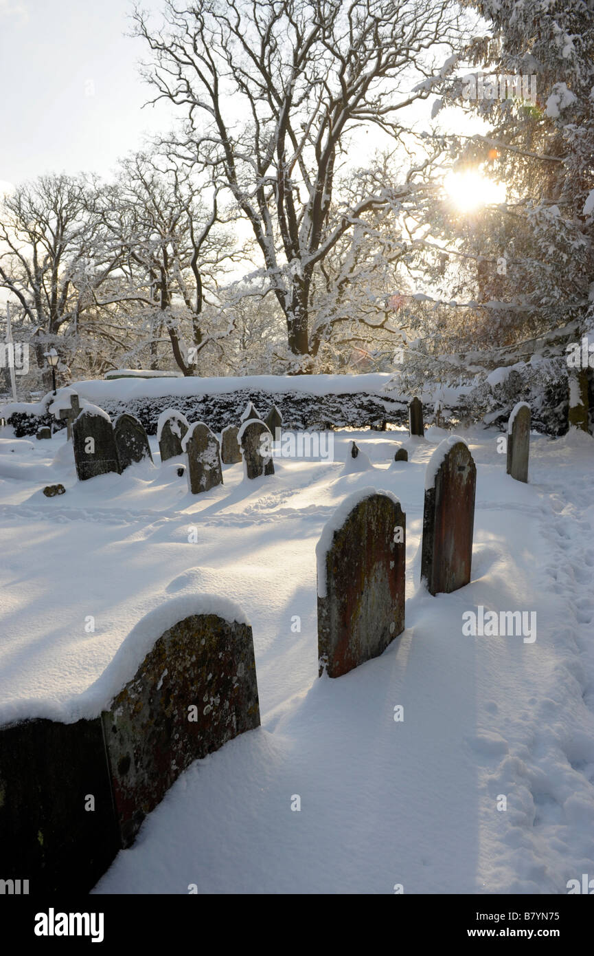 Snow-covered gravestones in an English country churchyard Stock Photo ...