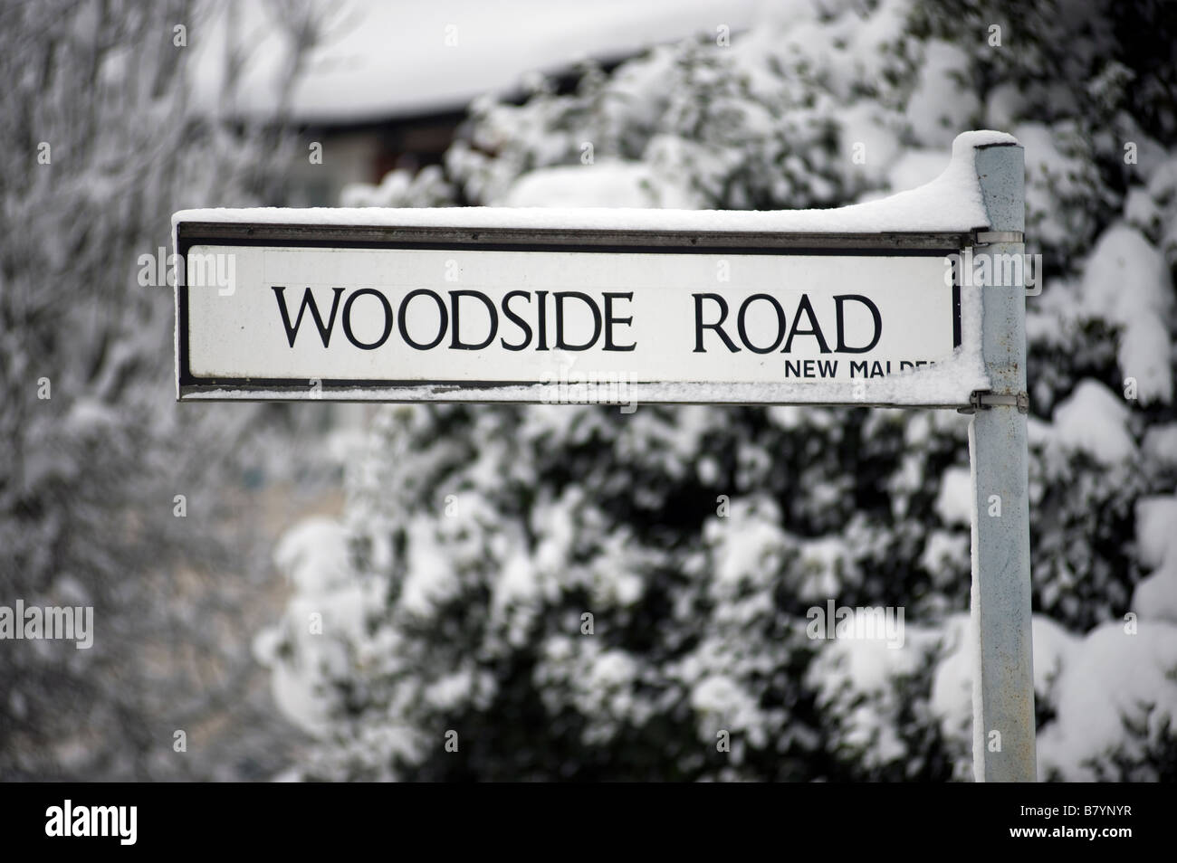 A snow covered road sign in a Suburban London Street Stock Photo - Alamy