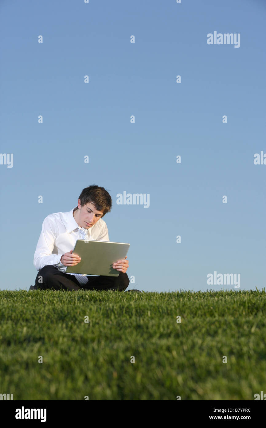 A Business man working outside in a park Stock Photo - Alamy