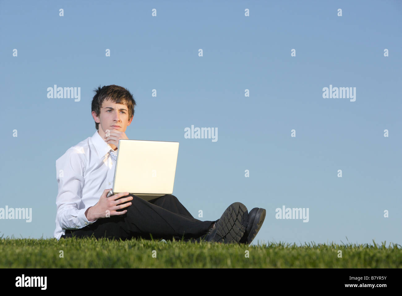 A Business man working outside in a park Stock Photo - Alamy