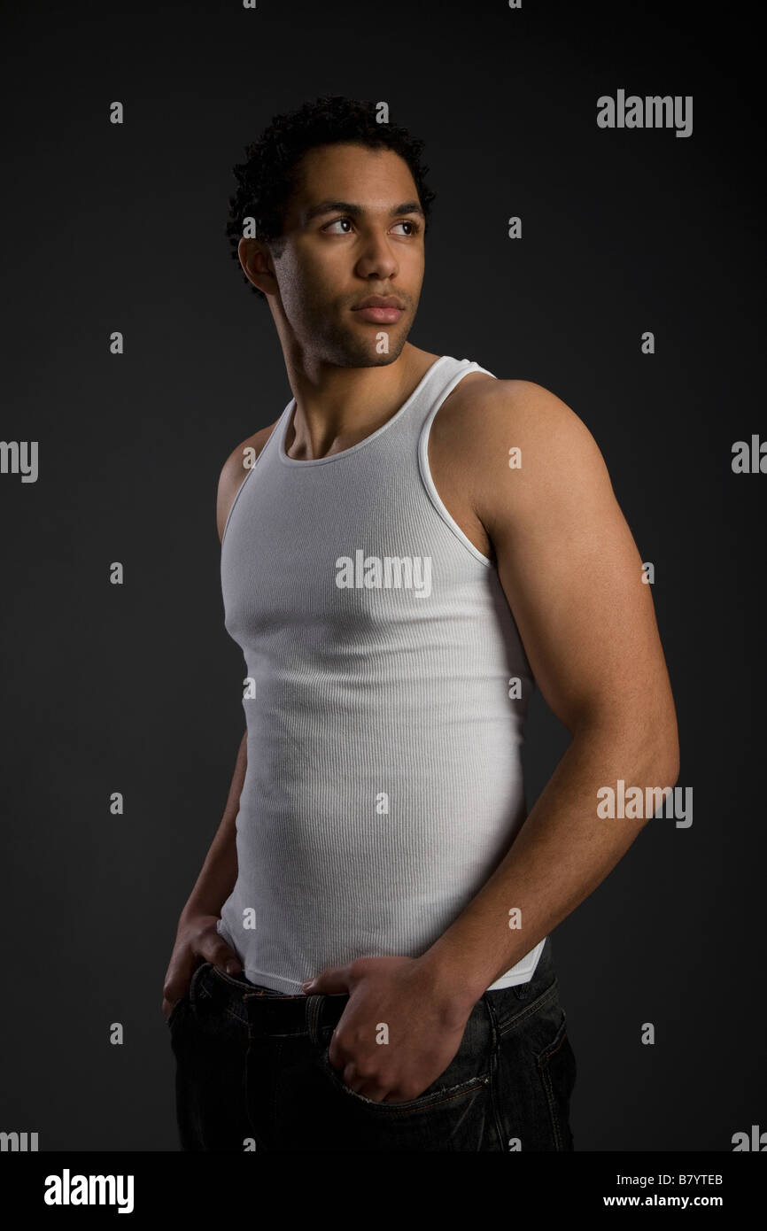 Man in muscle shirt Stock Photo - Alamy