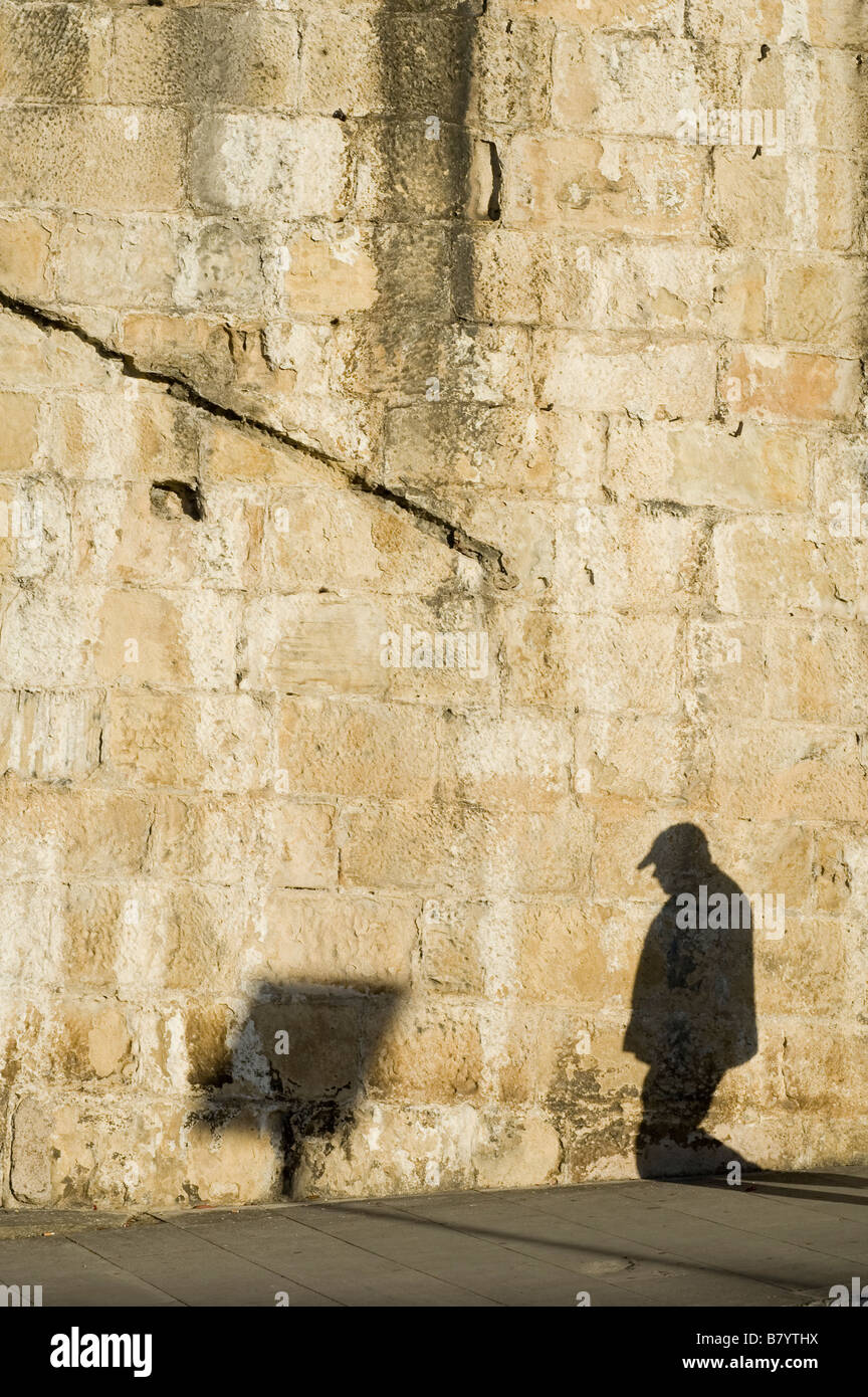 shadow of old man walking Stock Photo - Alamy