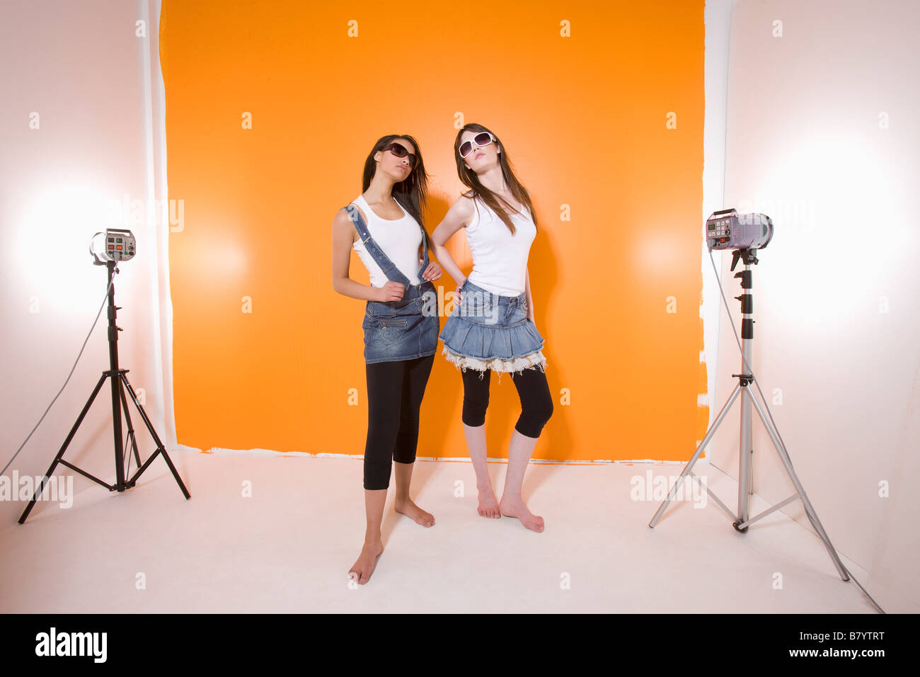 Two women posing Stock Photo - Alamy