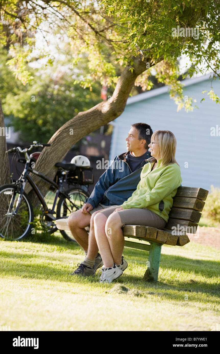 Couple sitting together Stock Photo - Alamy