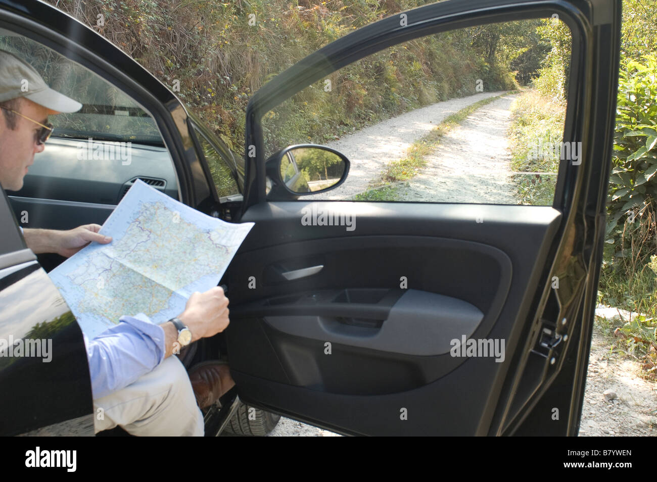 man map reading in car spain Stock Photo - Alamy