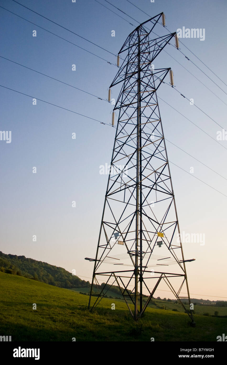 Electricity power pylon silhouetted against evening sky Stock Photo - Alamy