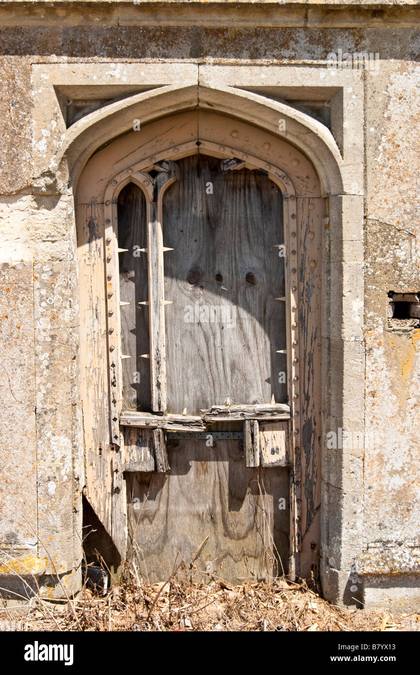 Ancient window or door opening fallen into disrepair Stock Photo - Alamy