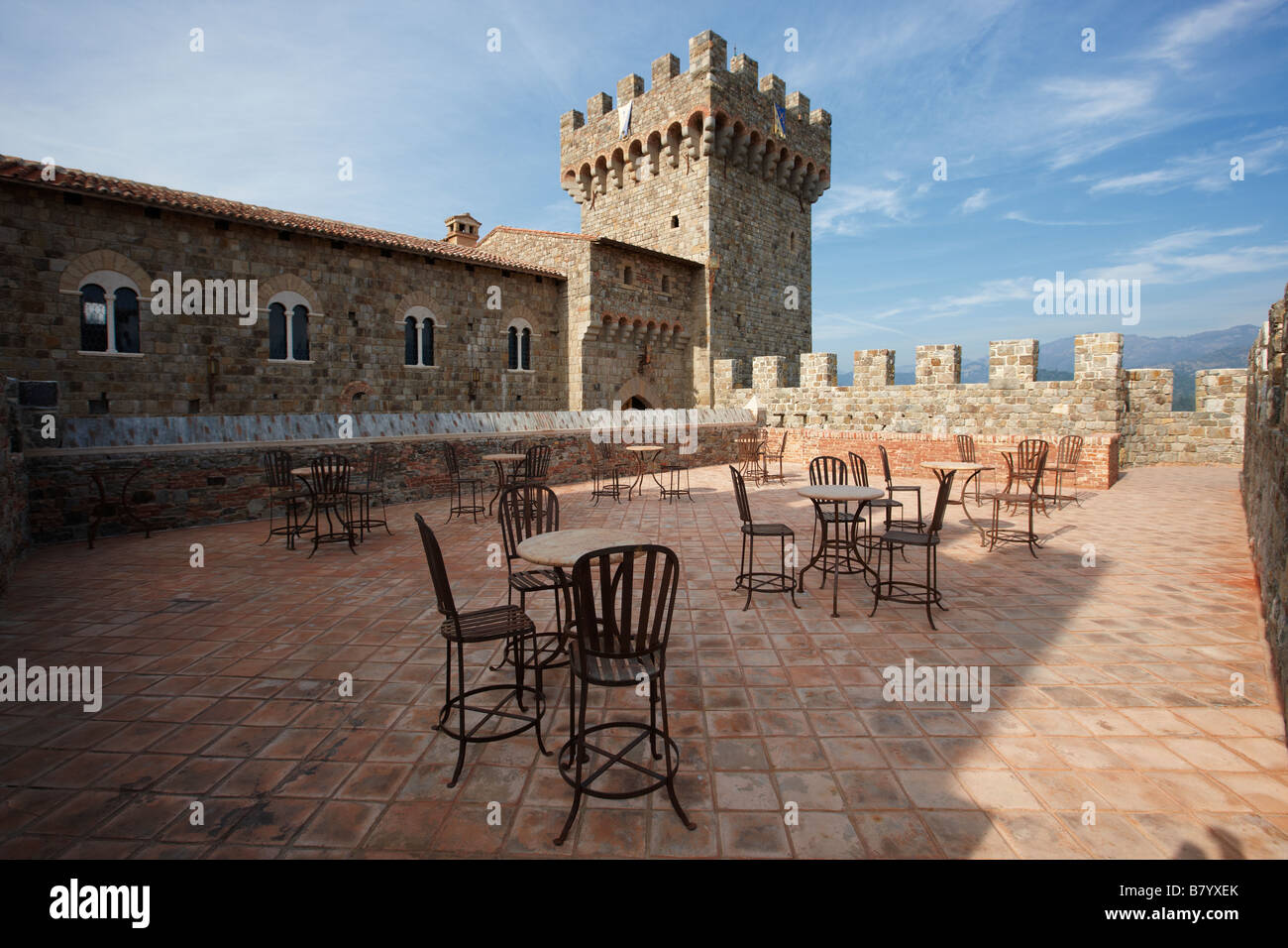 Outdoor terrace with tables and chairs for wine tasting in Castello di ...
