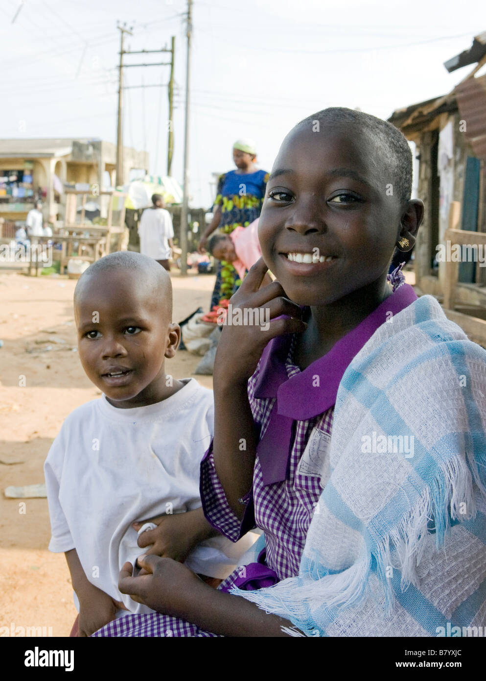A girl and her younger brother have returned from school and get ready ...