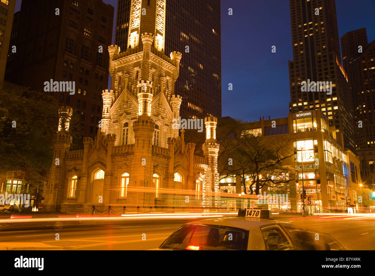 ILLINOIS Chicago Water Tower building on Michigan Avenue at dusk ...