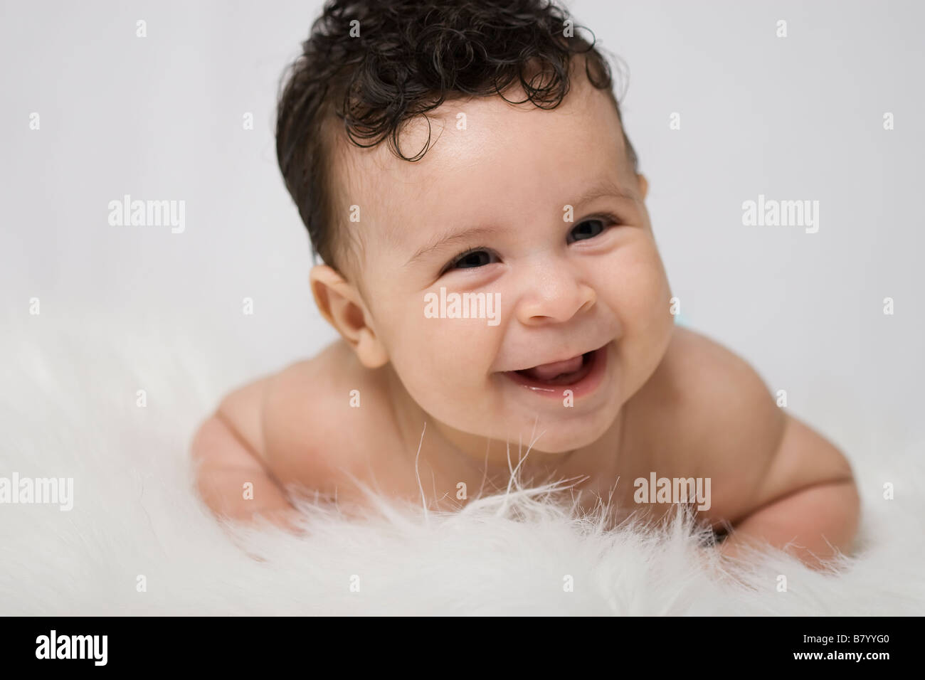 Portrait of a Hispanic Baby laughing Looking away from camera Stock ...