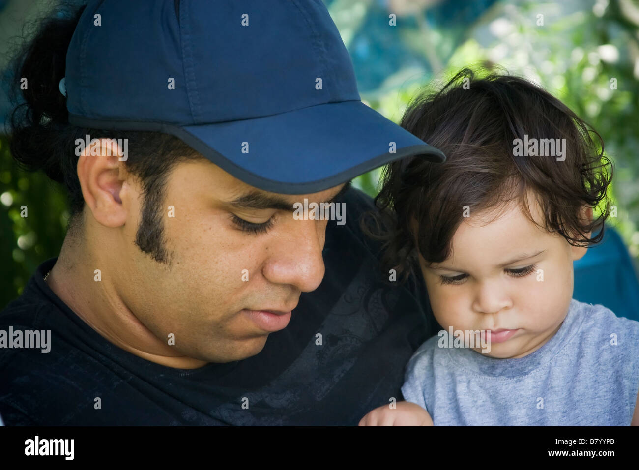 Hispanic father caring child hi-res stock photography and images - Alamy