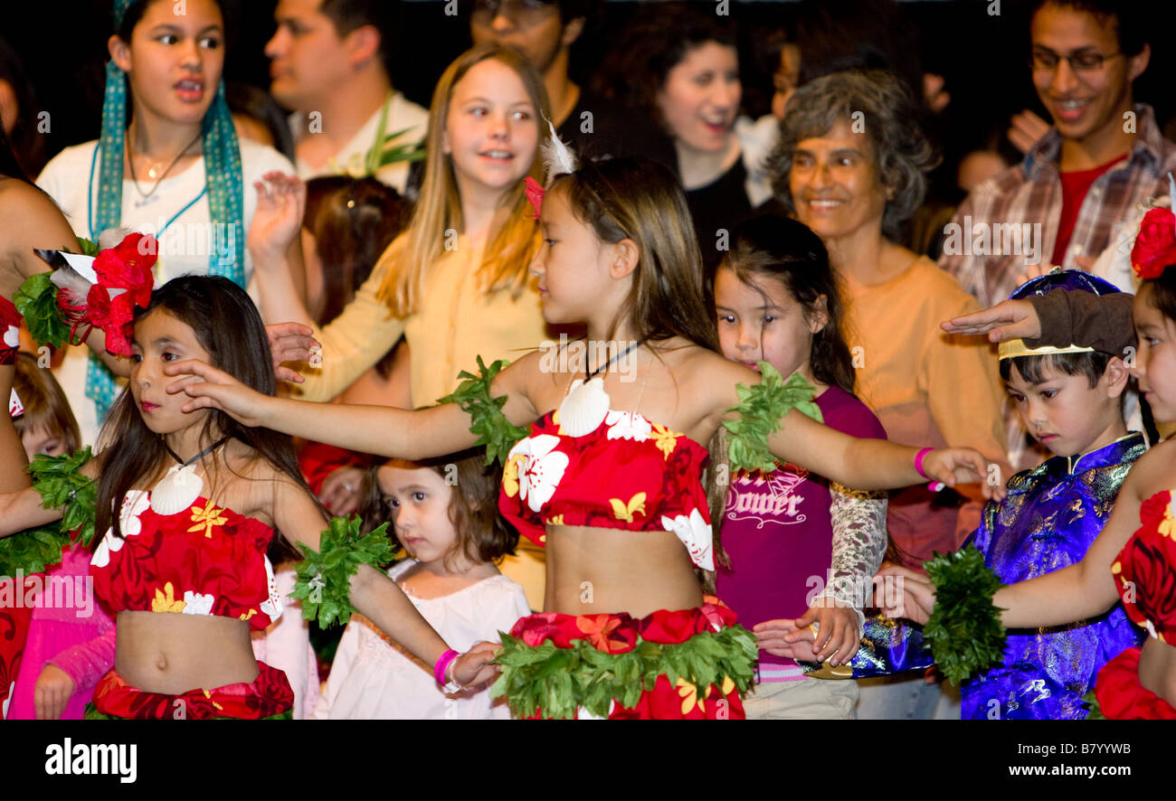 Young hula dancers with audience members Stock Photo - Alamy