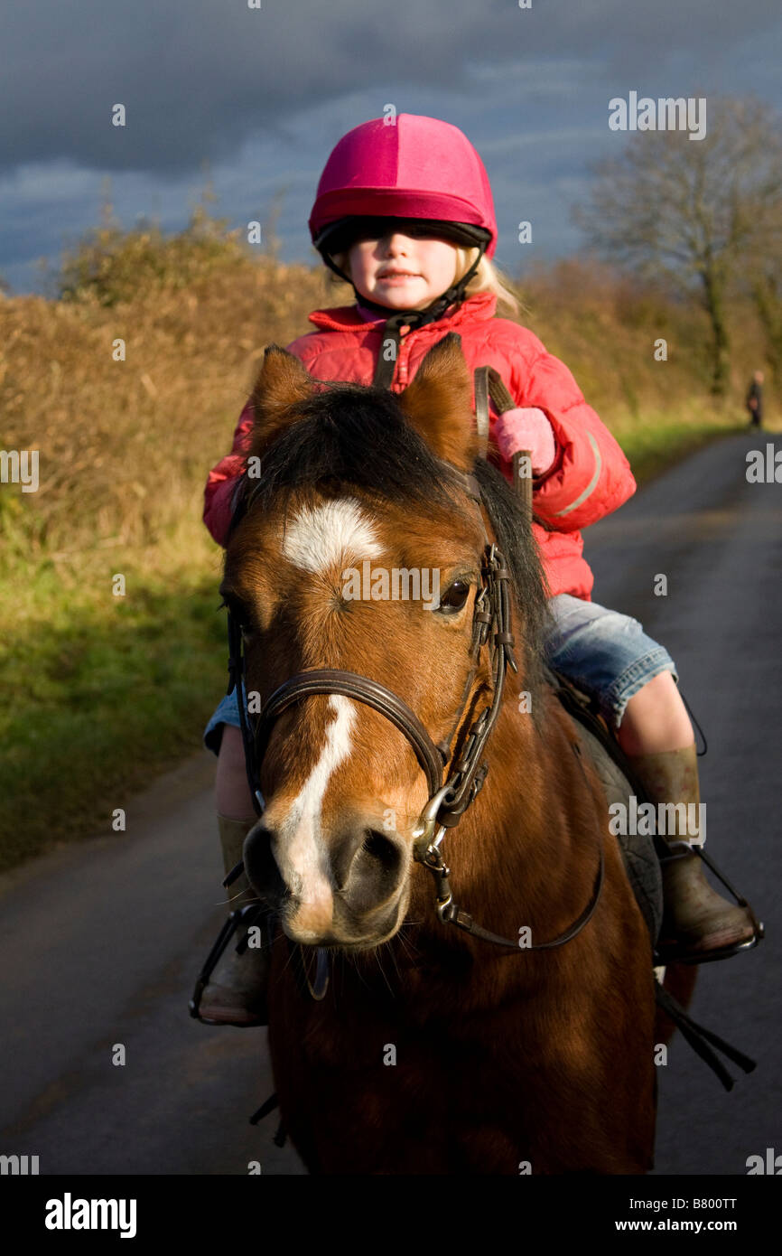 Young girl riding her pony Stock Photo - Alamy