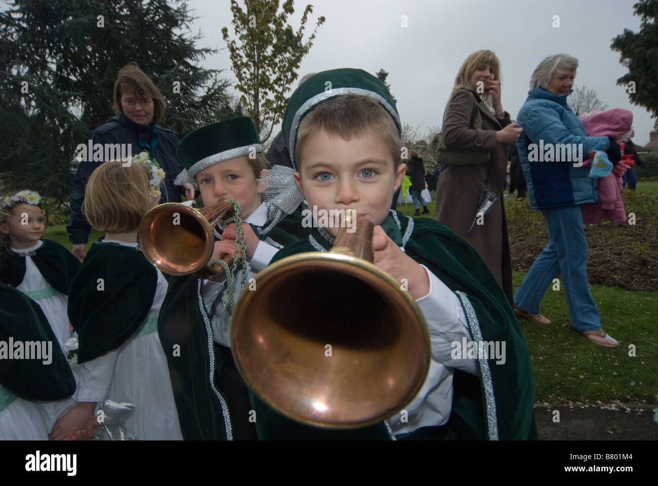 Young boy dressed as page at London May Queen crowning festival blows ...