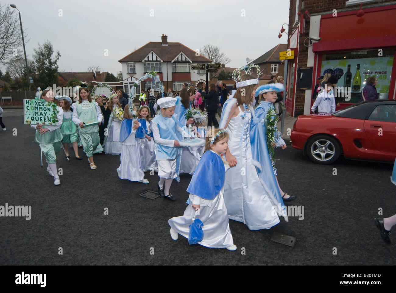 Girls in costumes in May Queen procession on street in South-East ...