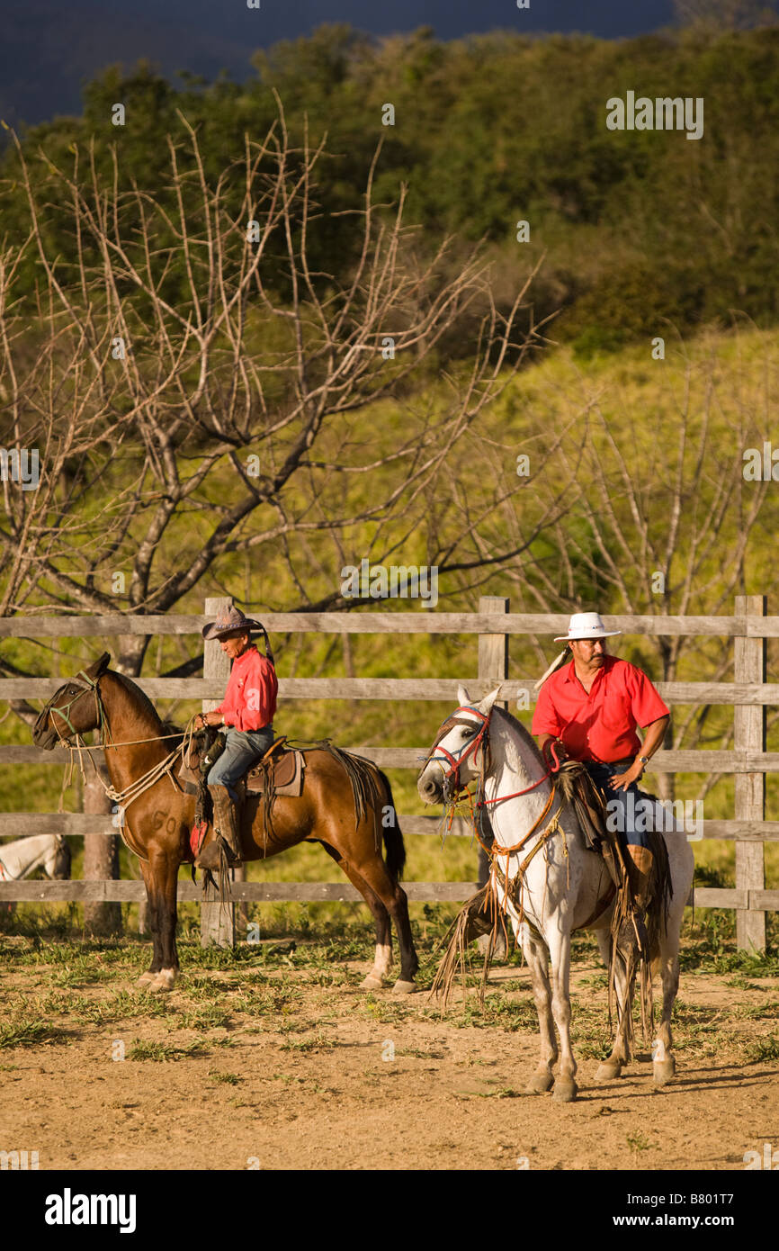 Cowboys sitting on fence hi-res stock photography and images - Alamy