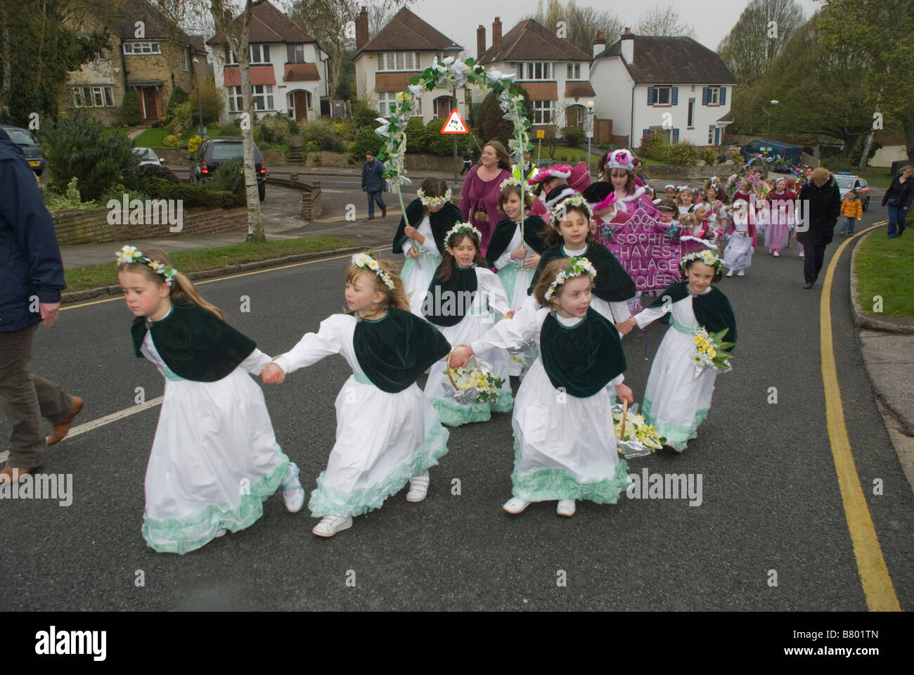 Young girls costumes with flowers in May Queen procession along ...