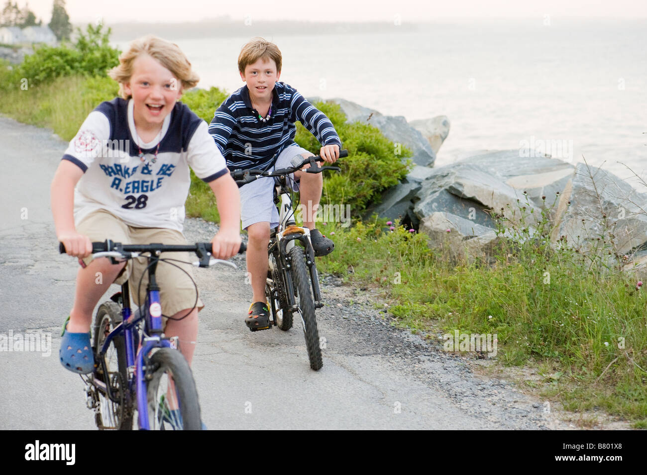 Kids riding their bikes together Stock Photo - Alamy