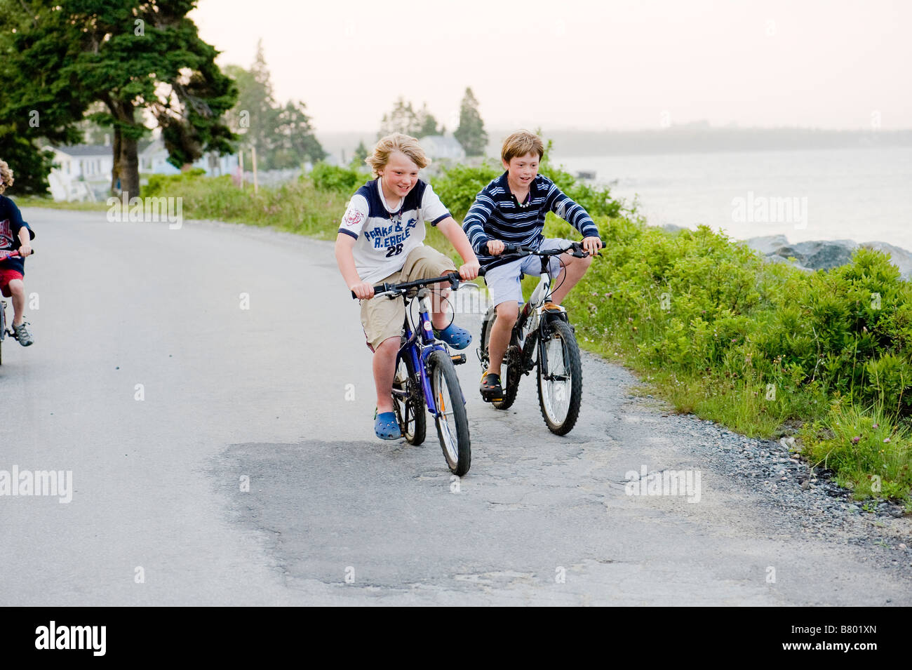 Kids riding their bikes together Stock Photo - Alamy