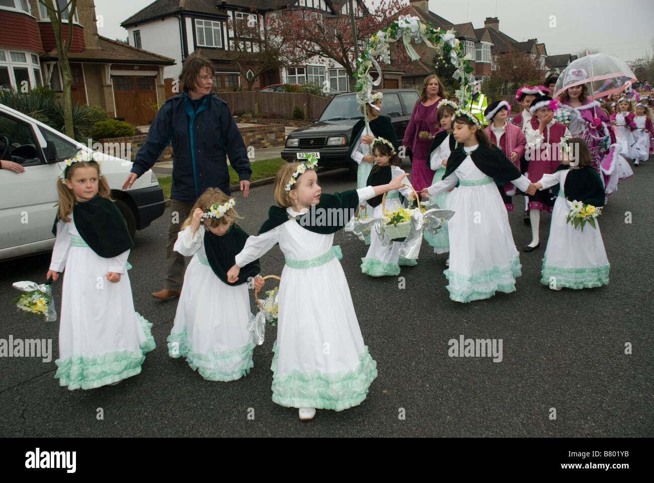 Young girls costumes with flowers in May Queen procession along ...