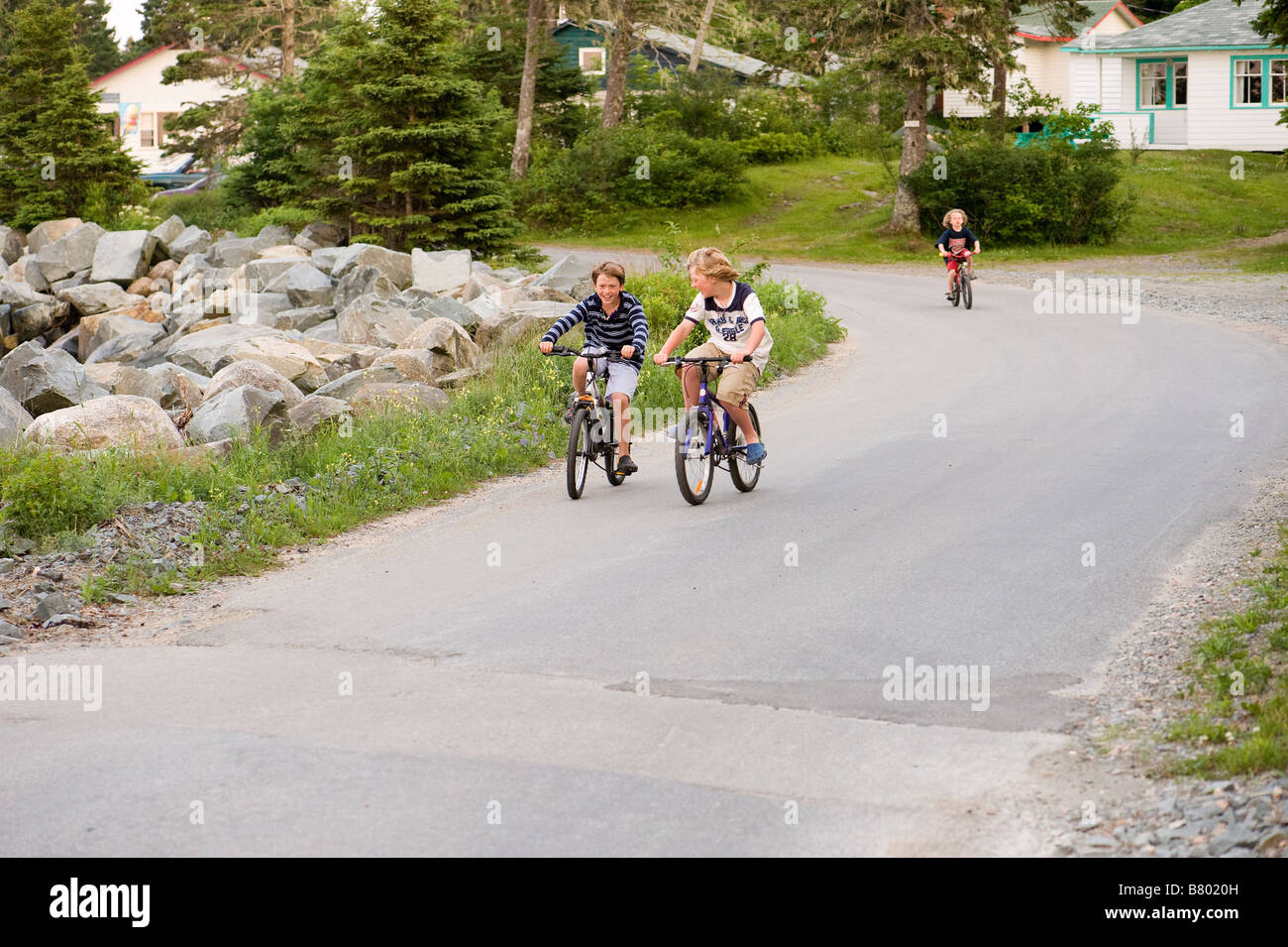 Kids riding their bikes together Stock Photo - Alamy